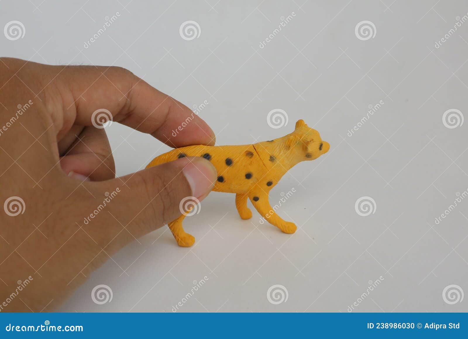 Yellow Leopard Shaped Toy Made of Plastic Stock Photo - Image of merry ...