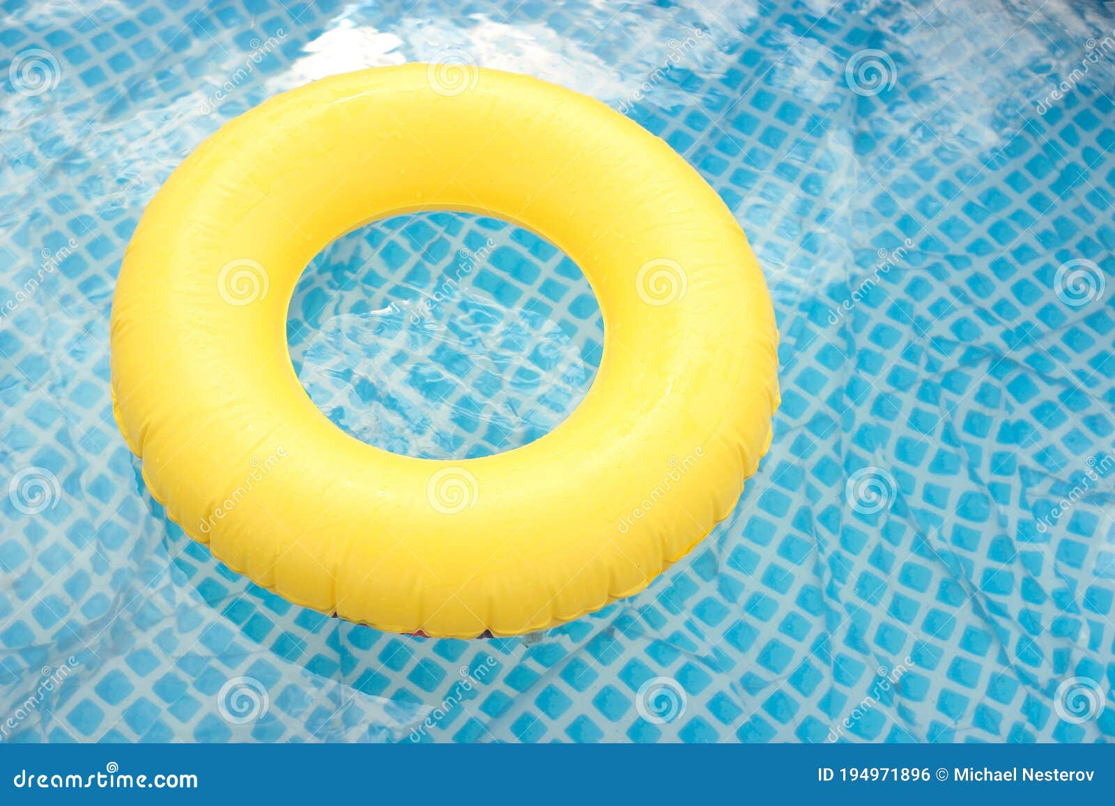 Yellow Lifebuoy Swimming in the Pool in Water Stock Photo - Image of ...