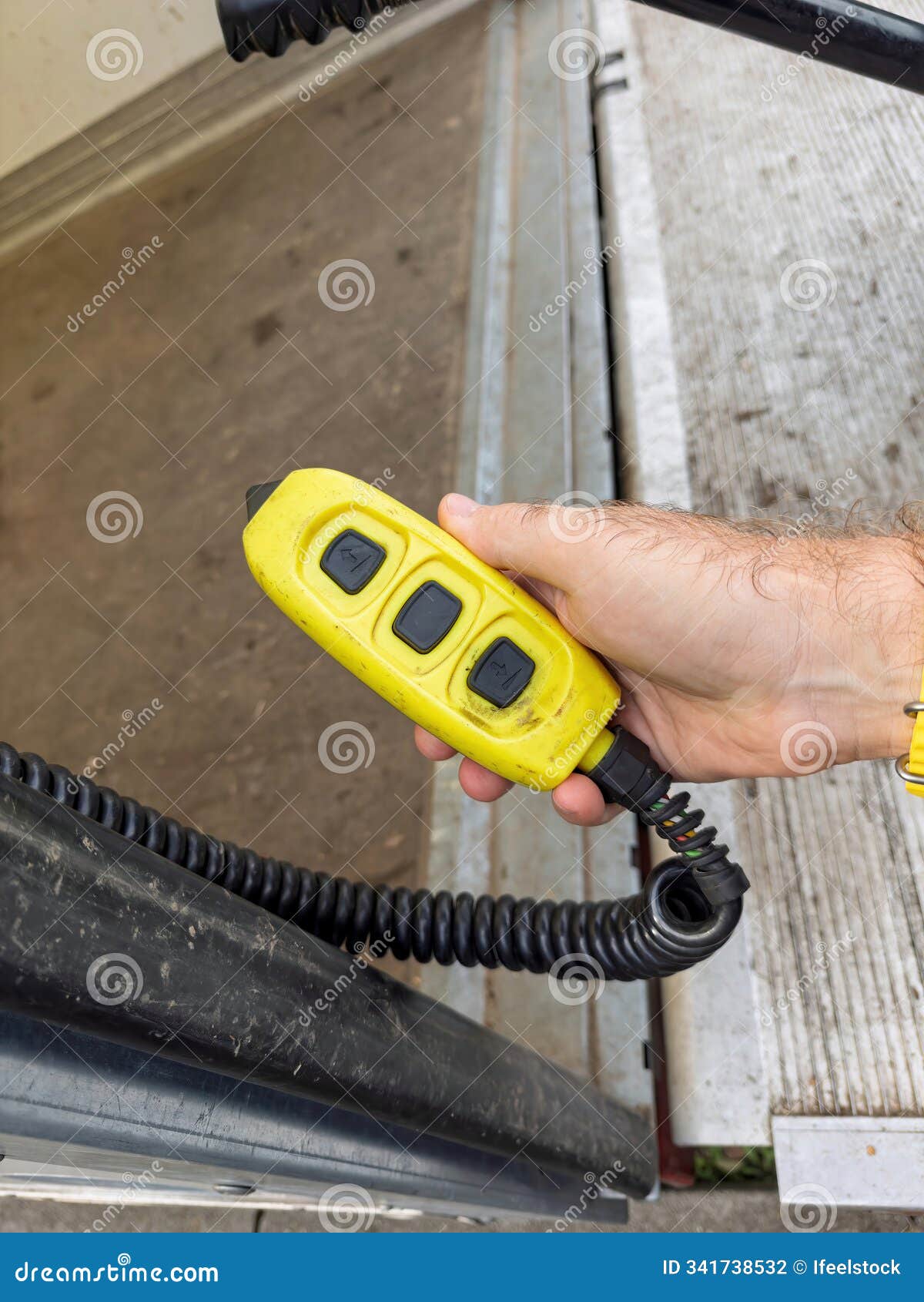 Yellow Liftgate Remote Control Held Near Truck Platform Stock Photo ...