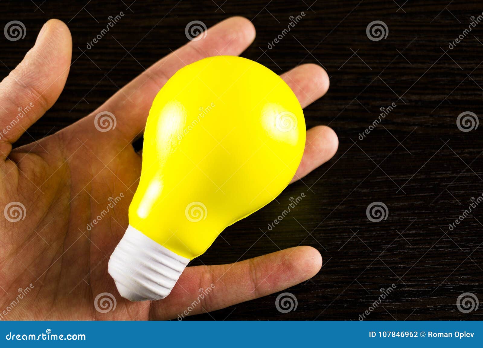 Yellow Light Bulb As a Symbol of Idea on a Dark Background Stock Photo ...