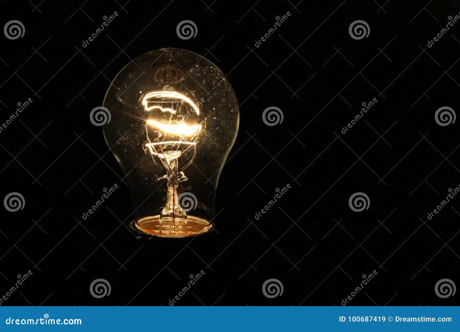 Yellow Light Bulb with Dust Particles and Black Background Stock Image ...