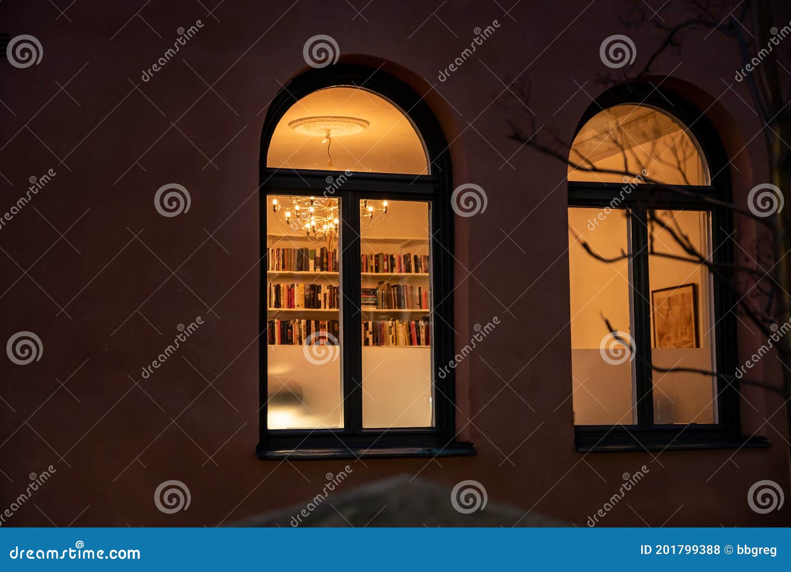 Yellow Light from Window Late at Night. Home Library. Stock Photo ...