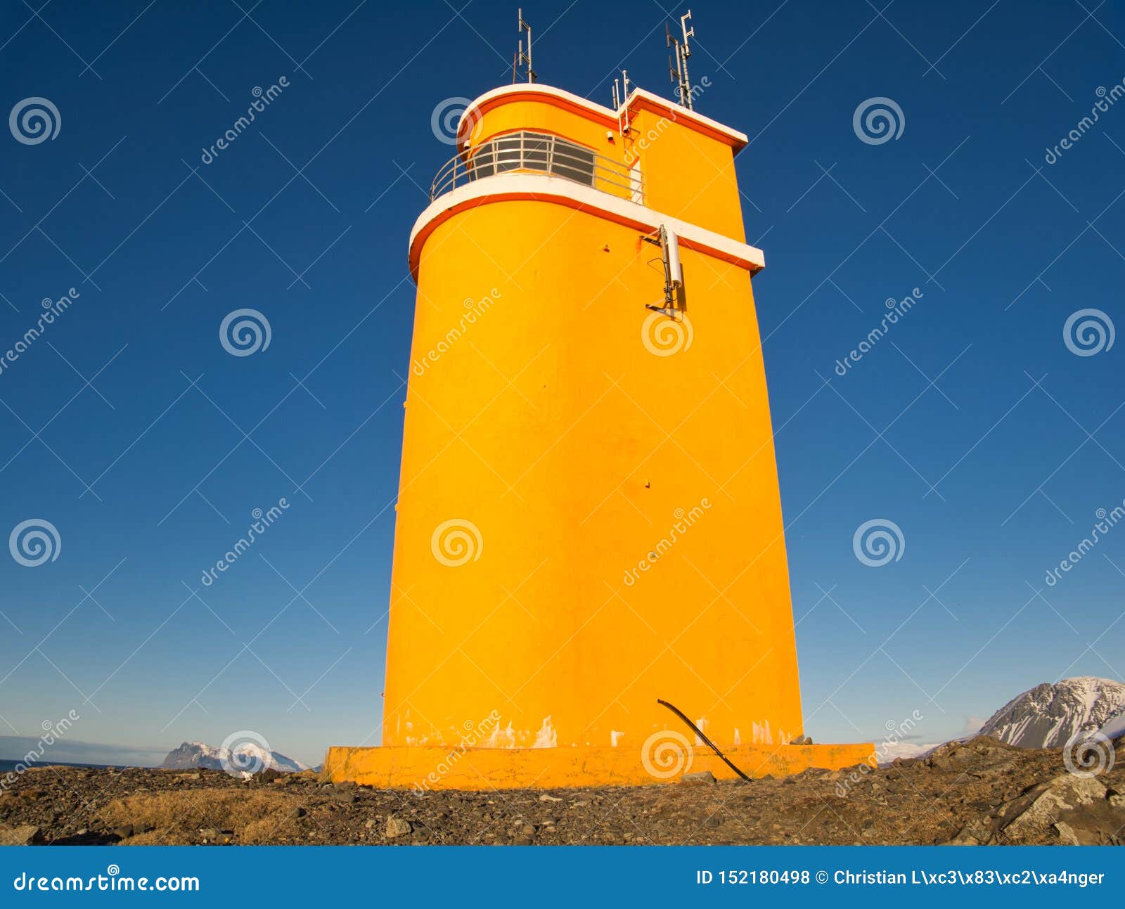 A Yellow Lighthouse on the Coast of Iceland Stock Photo - Image of ...