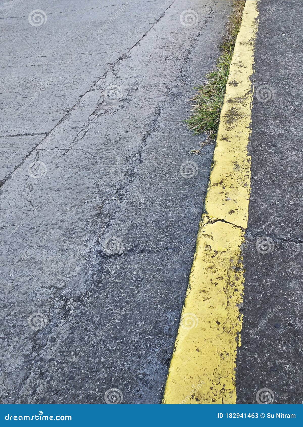 Yellow Line In Poor Condition On Asphalt Road Texture Background ...