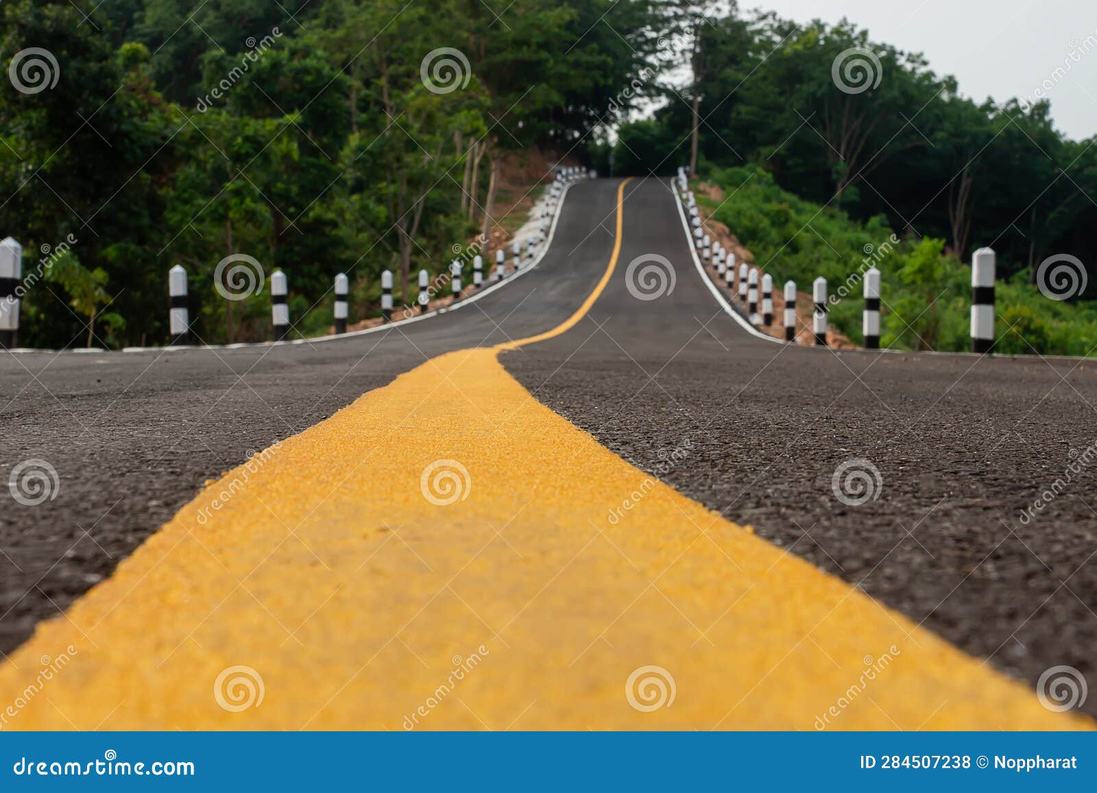 Yellow line on the road stock photo. Image of pattern - 284507238