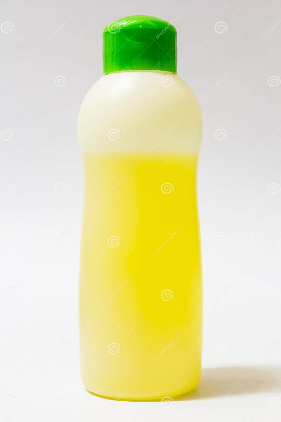 Yellow liquid in bottle stock photo. Image of bottle - 31125088