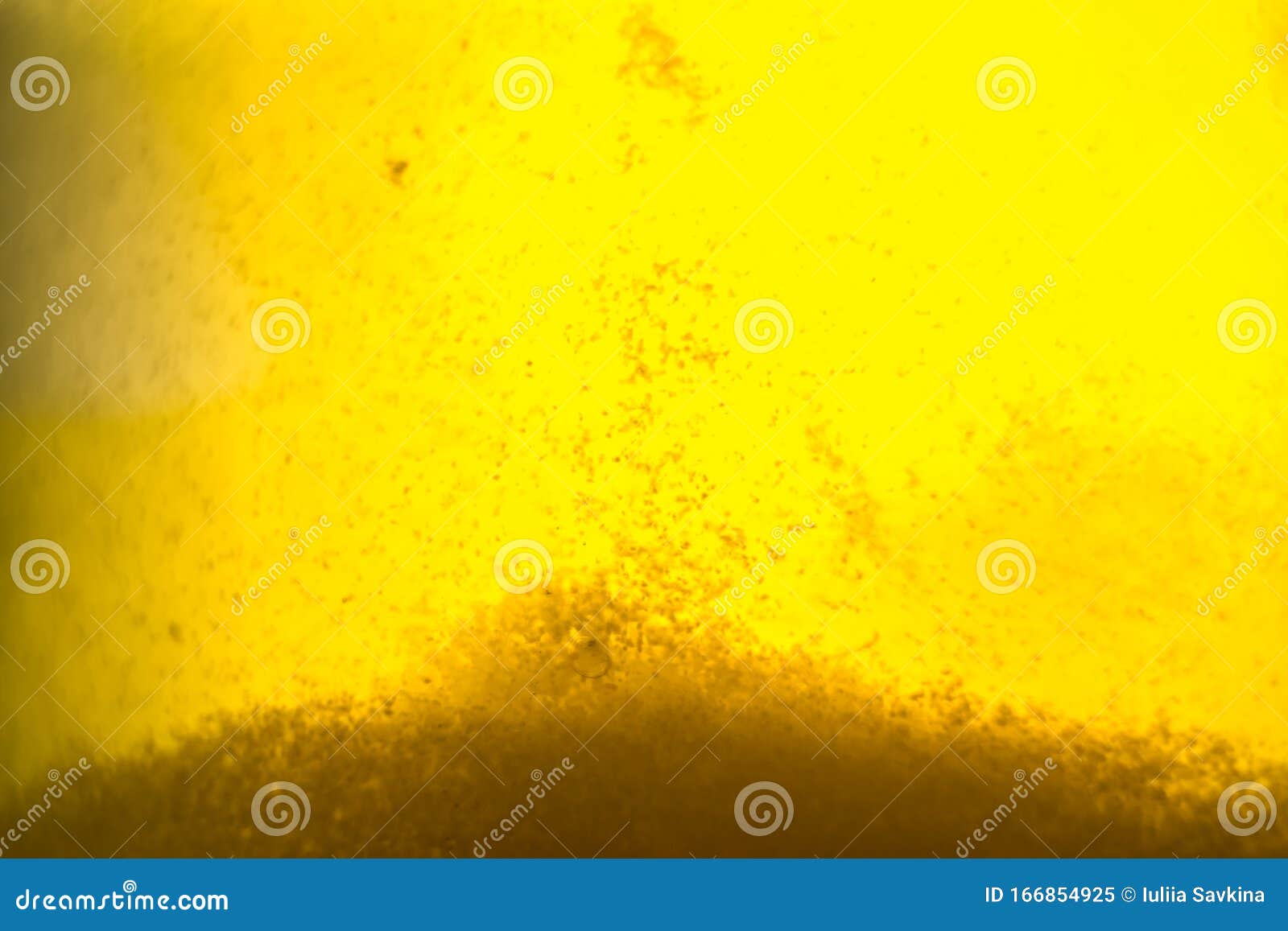 Yellow Liquid Honey Texture Close Up with Some Solid Particles in ...