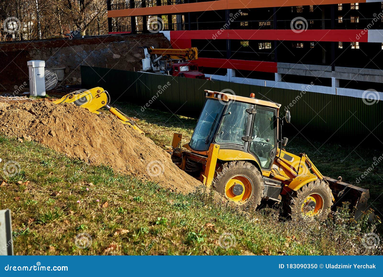 Yellow Loader Backhoe Digs Under the Road Stock Photo - Image of heavy ...