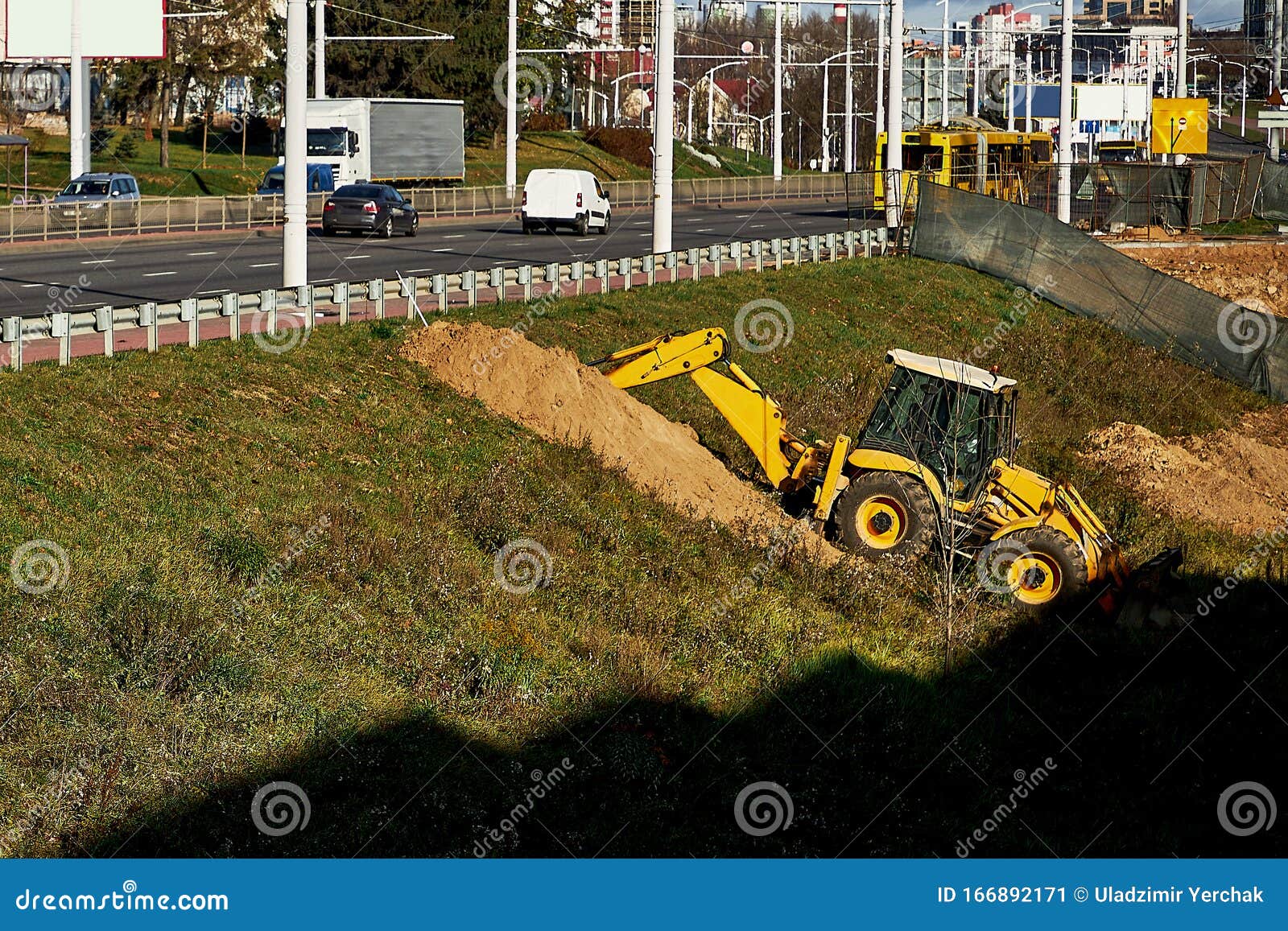 Yellow Loader Backhoe Digs Under the Road Stock Image - Image of ...