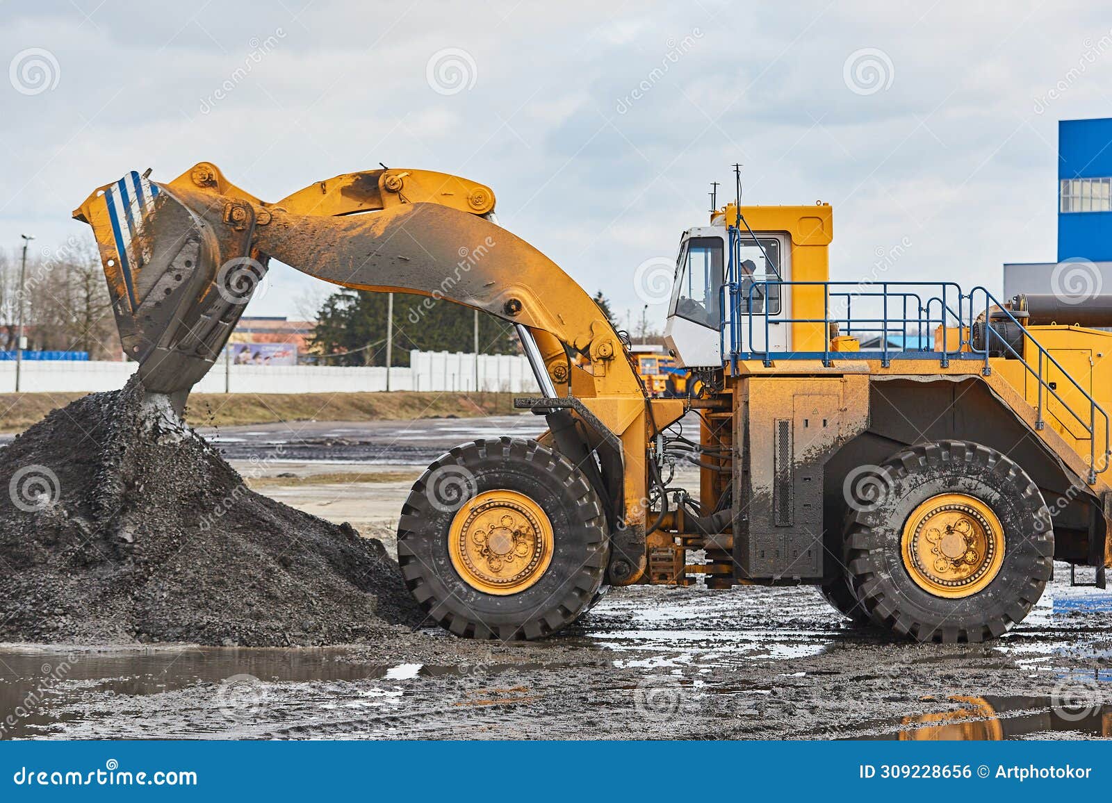 A Yellow Loader Pours a Pile of Rubble and Dirty Earth for Loading into ...