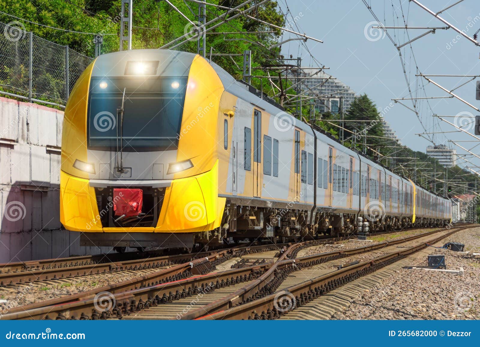 Yellow Long Suburban Passenger Electric Train Rides on the Railway ...