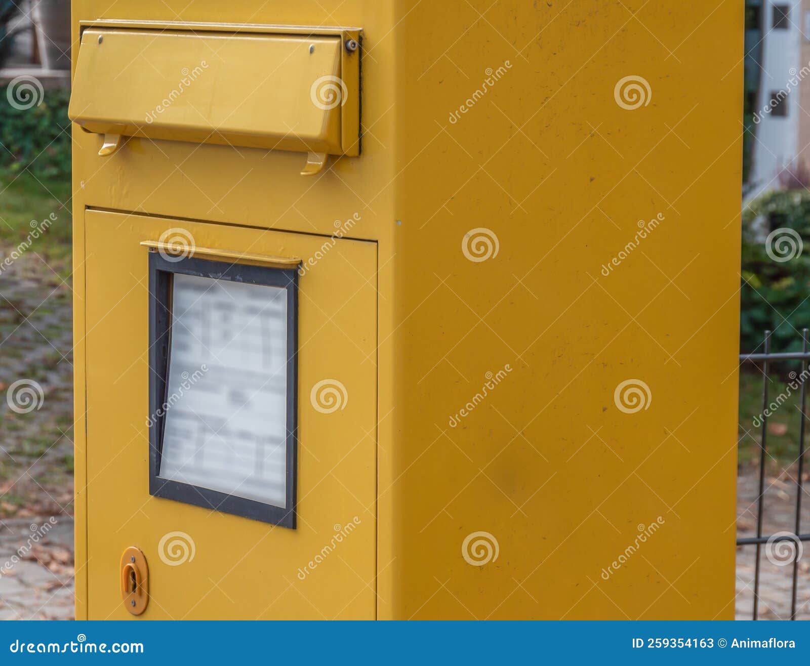 Yellow mailbox in the city stock image. Image of container - 259354163