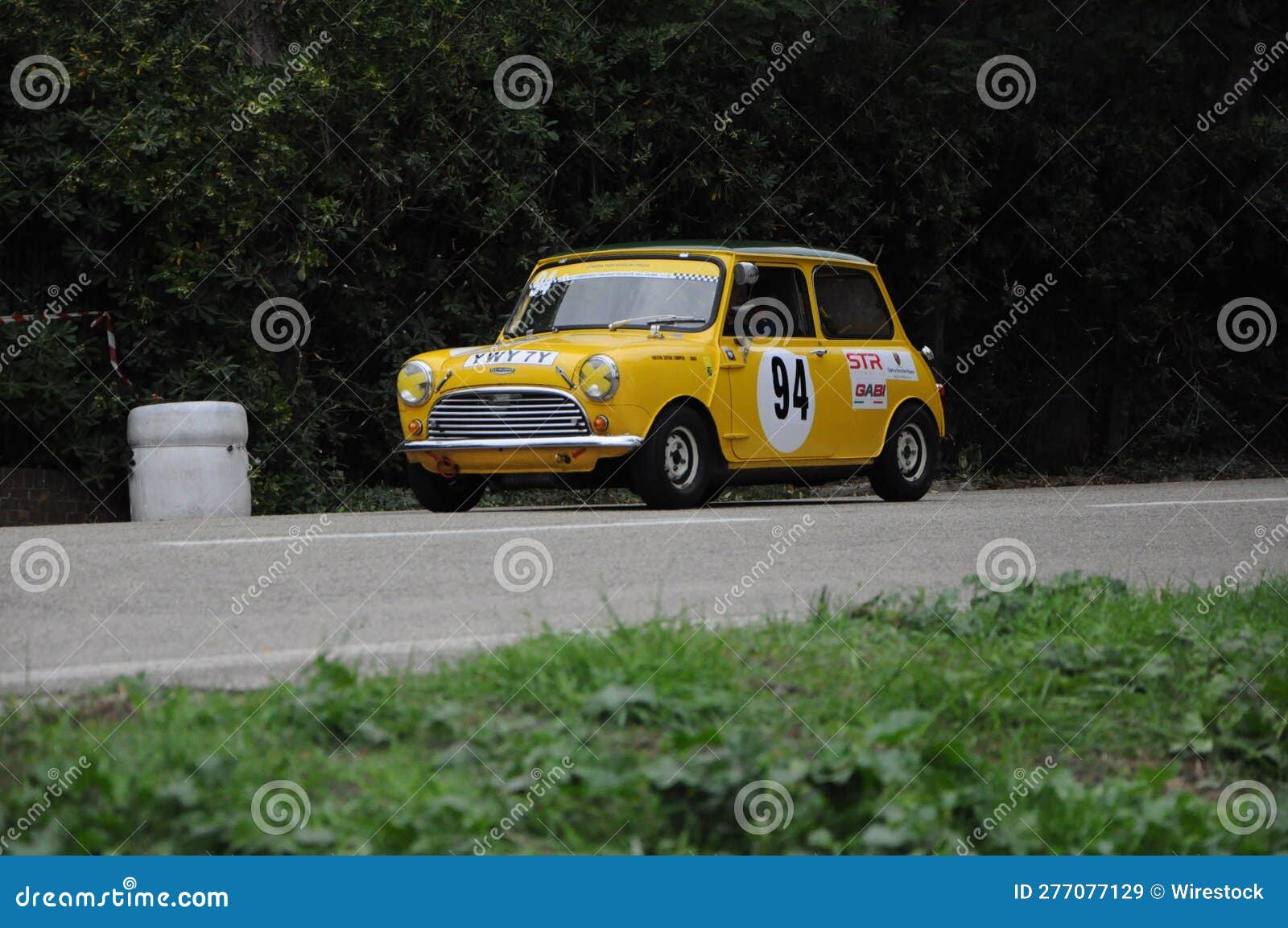 Yellow Mini Cooper Car Racing on the Road. Editorial Stock Image ...