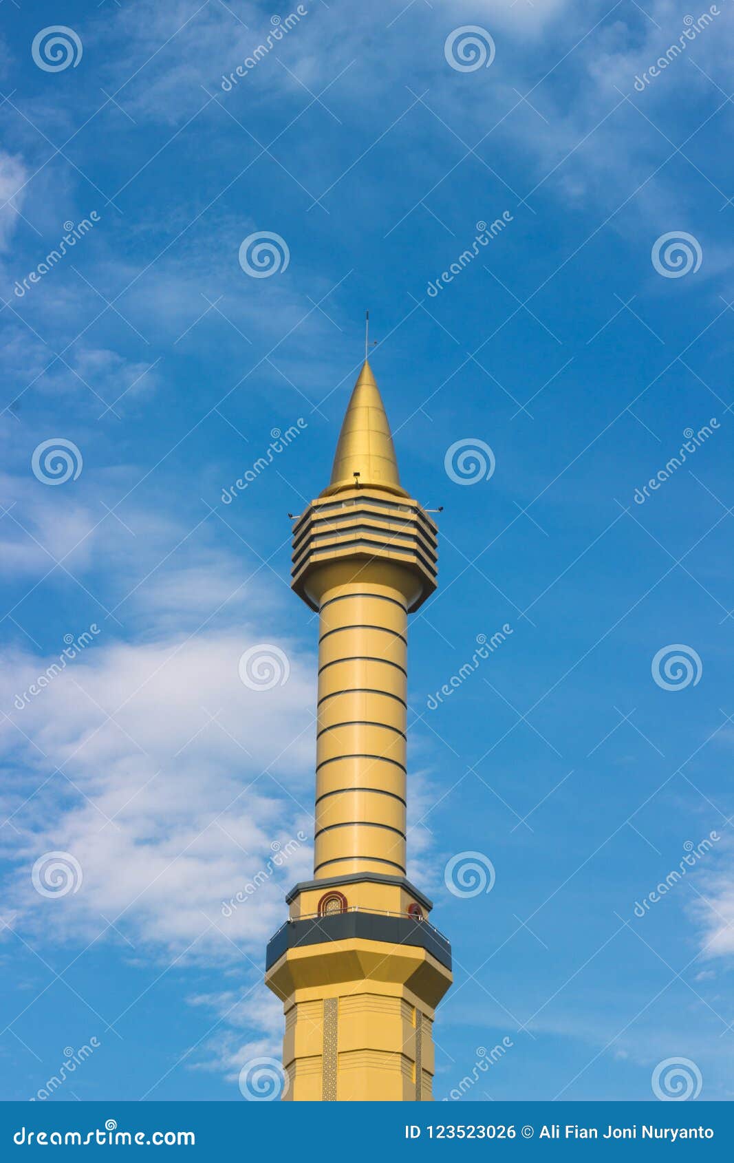 Yellow Mosque Tower in a Blue Sky Stock Photo - Image of mosque ...