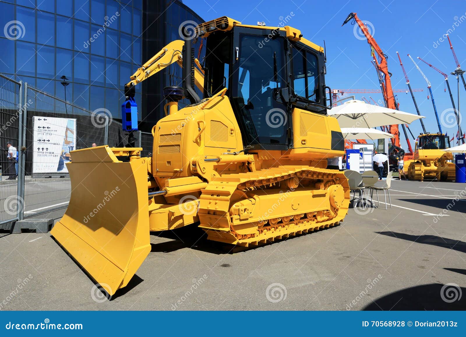Yellow new tractor editorial stock photo. Image of business - 70568928