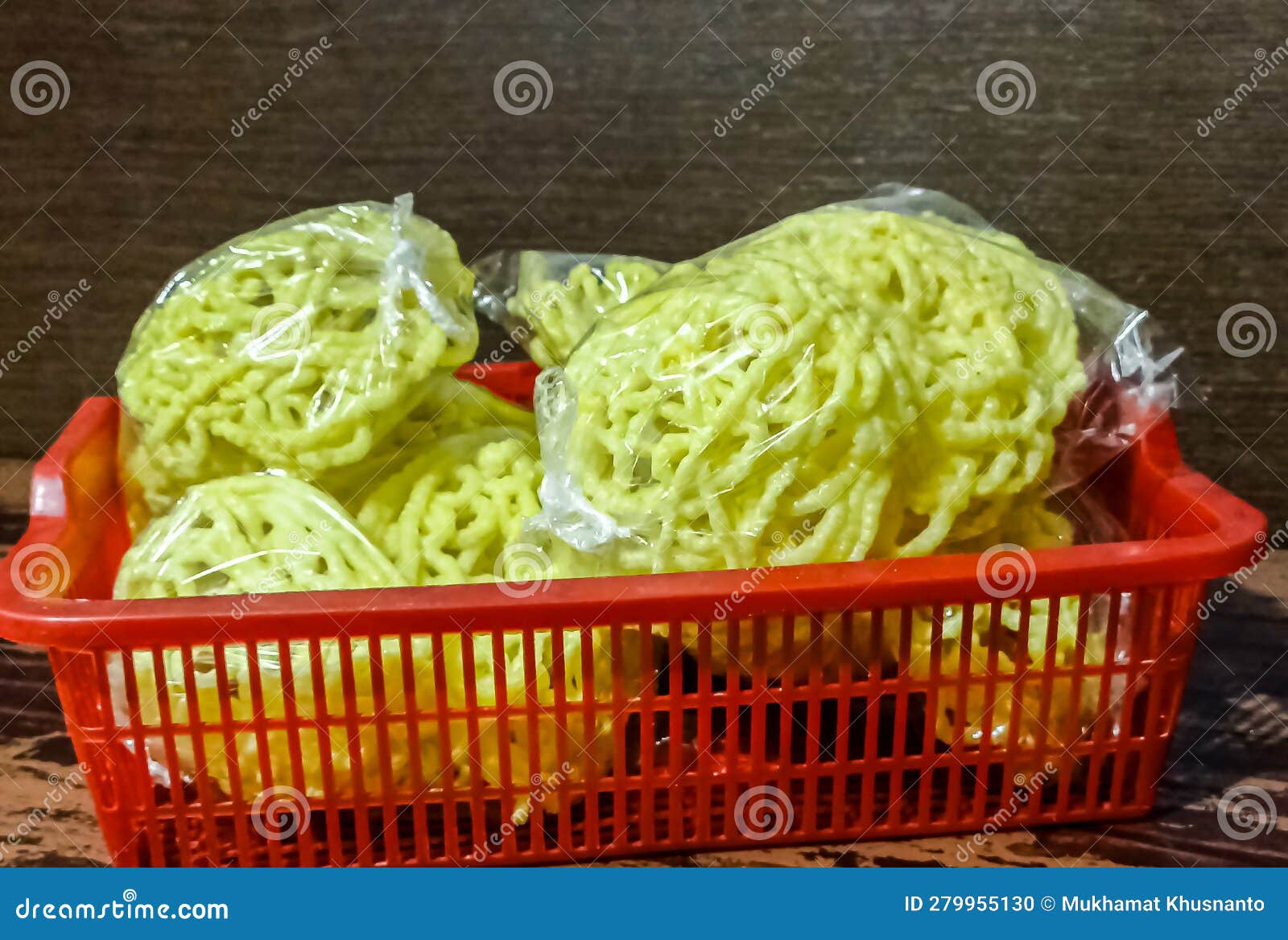 Yellow Noodle Crackers in Plastic in Red Container Stock Photo - Image ...
