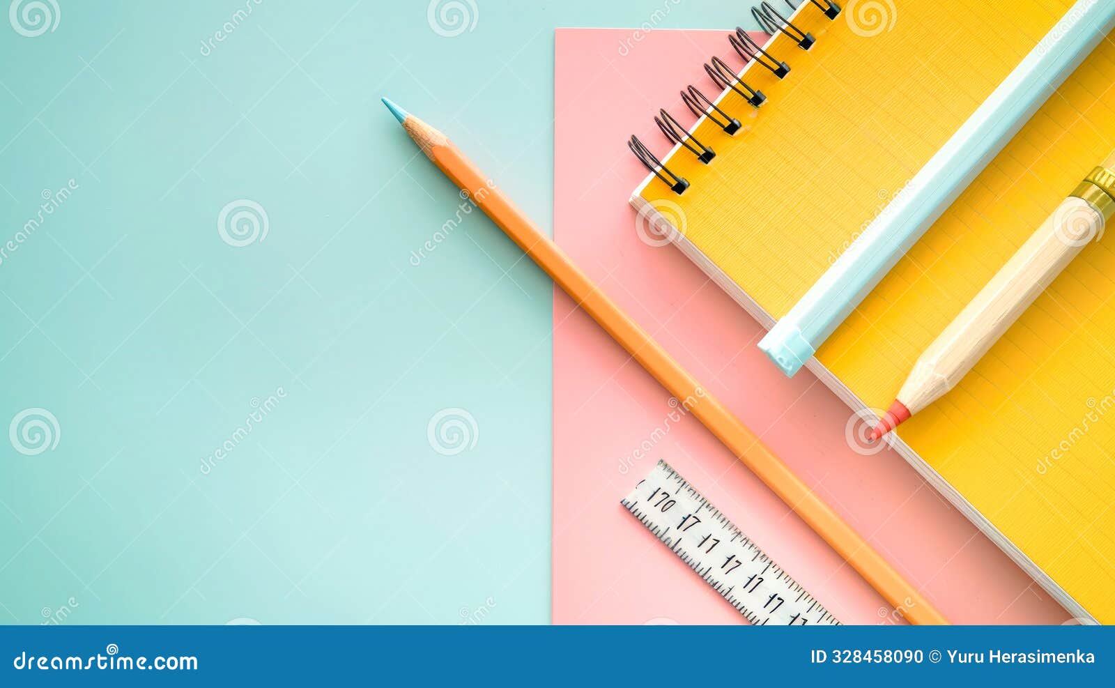 A Yellow Notepad, Ruler, and Pencil Rest on a Blue and Pink Surface ...
