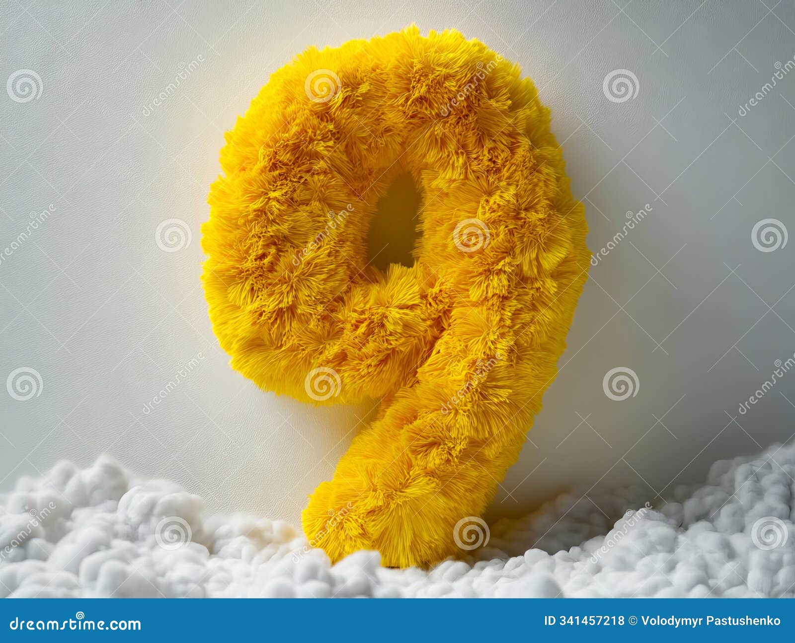 A Yellow Number 9 Made Out of Fluffy Yellow Yarn on a White Background ...