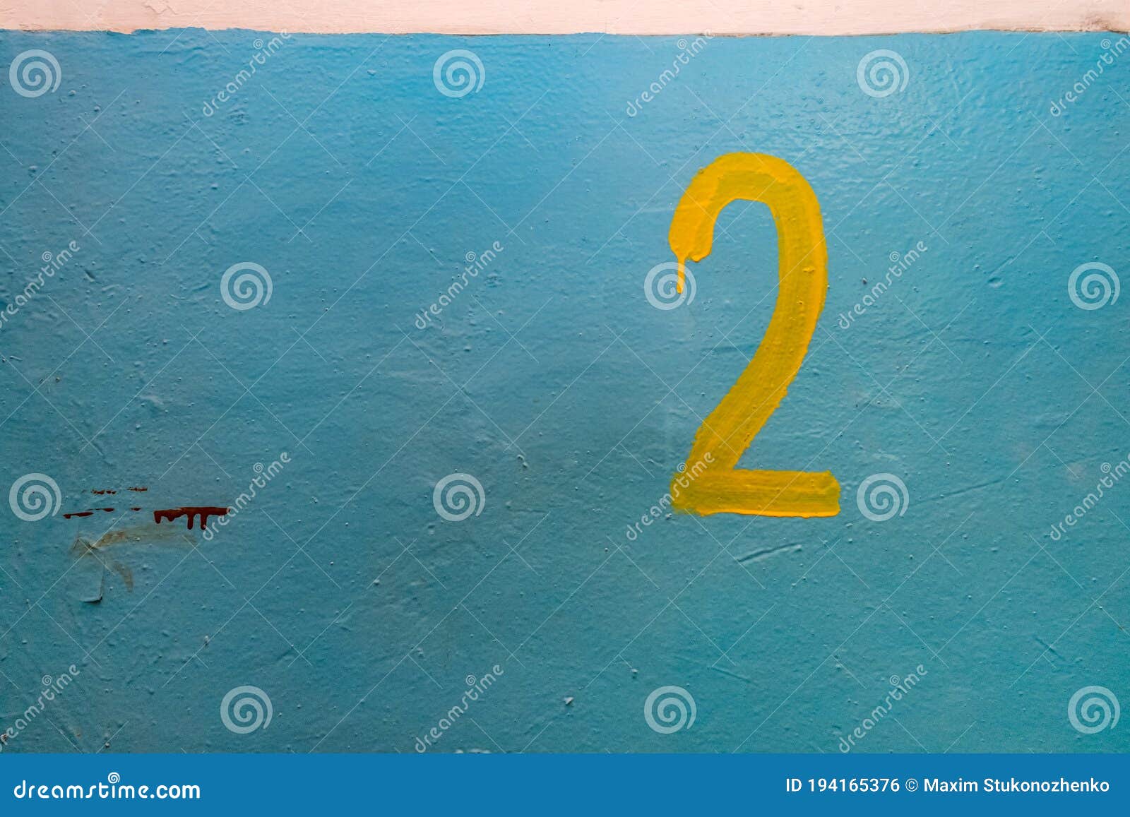 Yellow Number Two on the Blue Painted Wall Stock Photo - Image of dirty ...