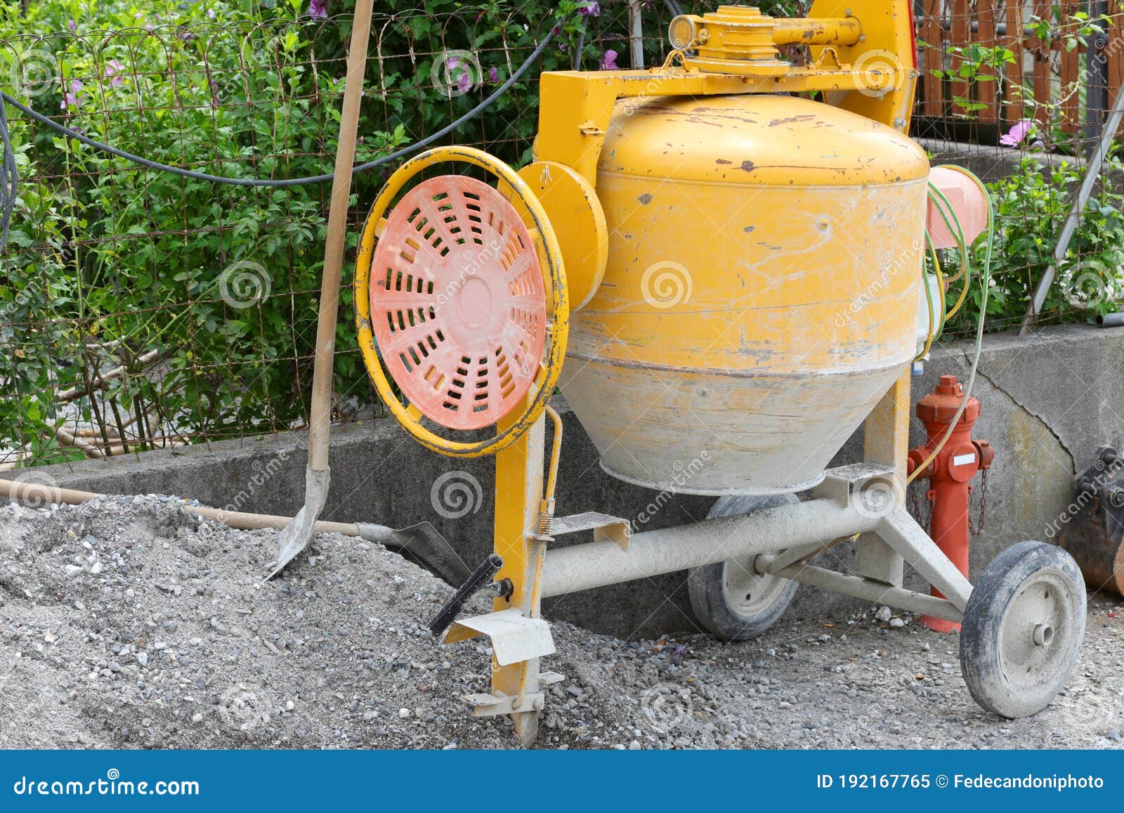 Yellow old Concrete Mixer stock image. Image of labor - 192167765