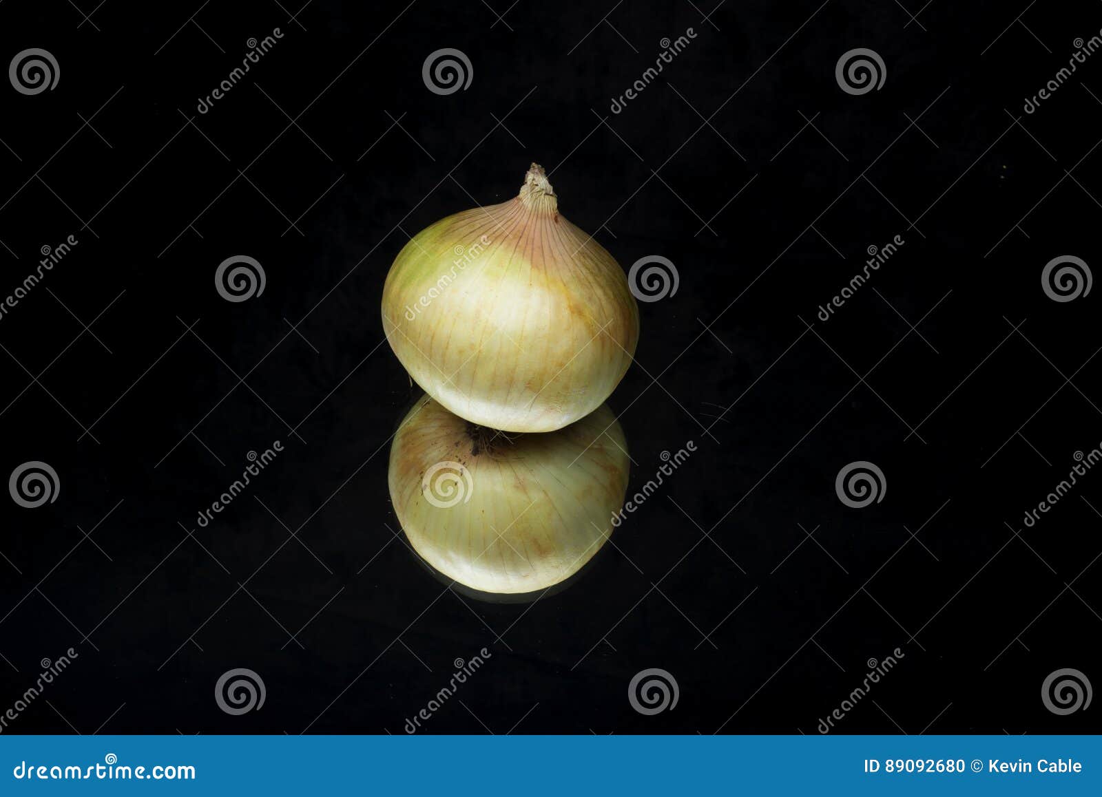 Yellow Onion on Reflective Surface Stock Photo - Image of reflection ...