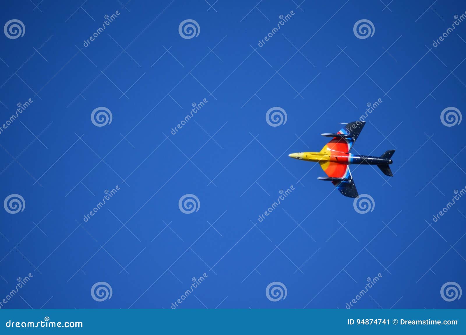 Yellow, Orange, Red and Blue Fighter Aircraft Flying Left Stock Image ...