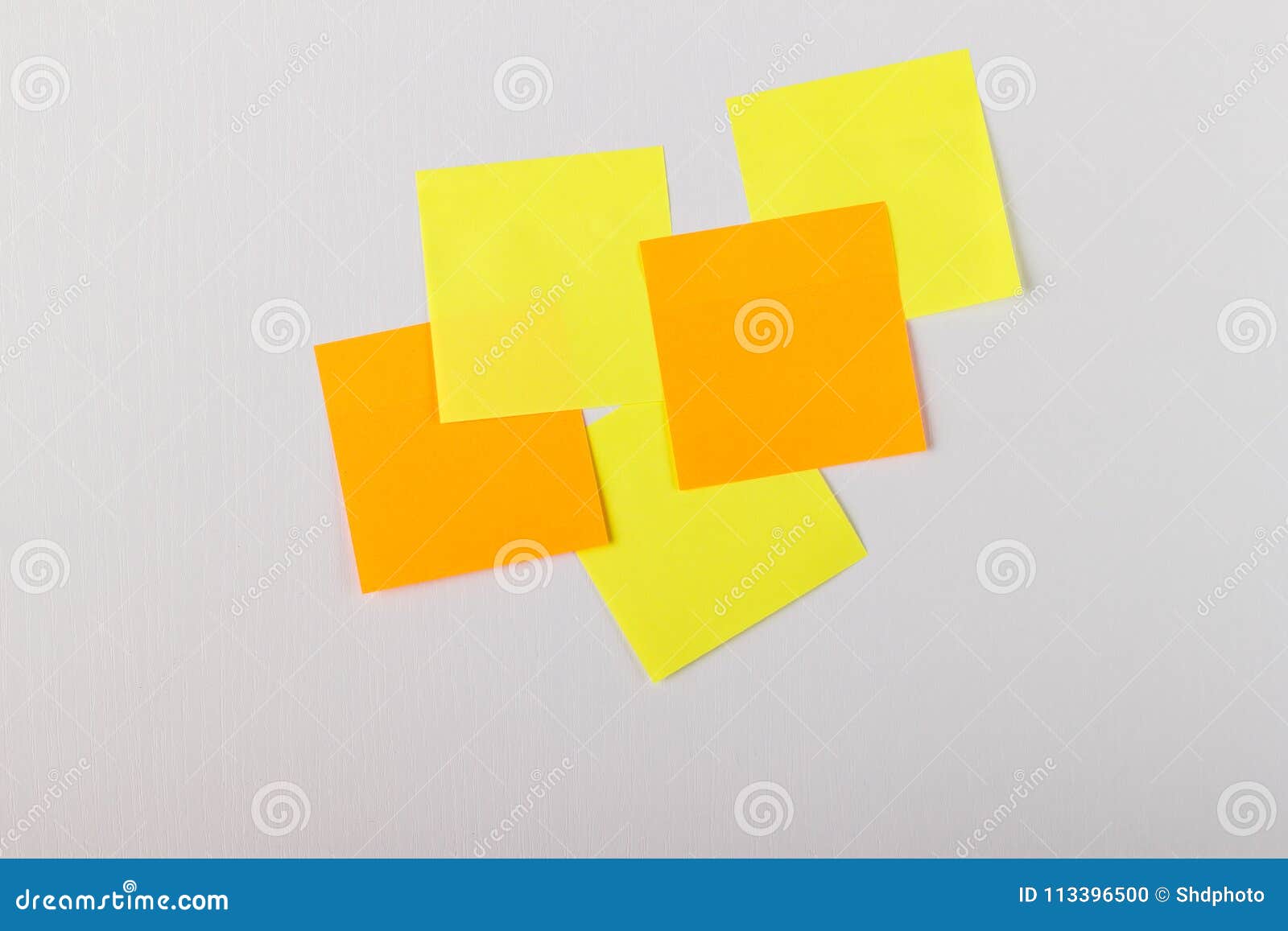 Yellow and Orange Sticky Notes on a White Wall Stock Photo - Image of ...