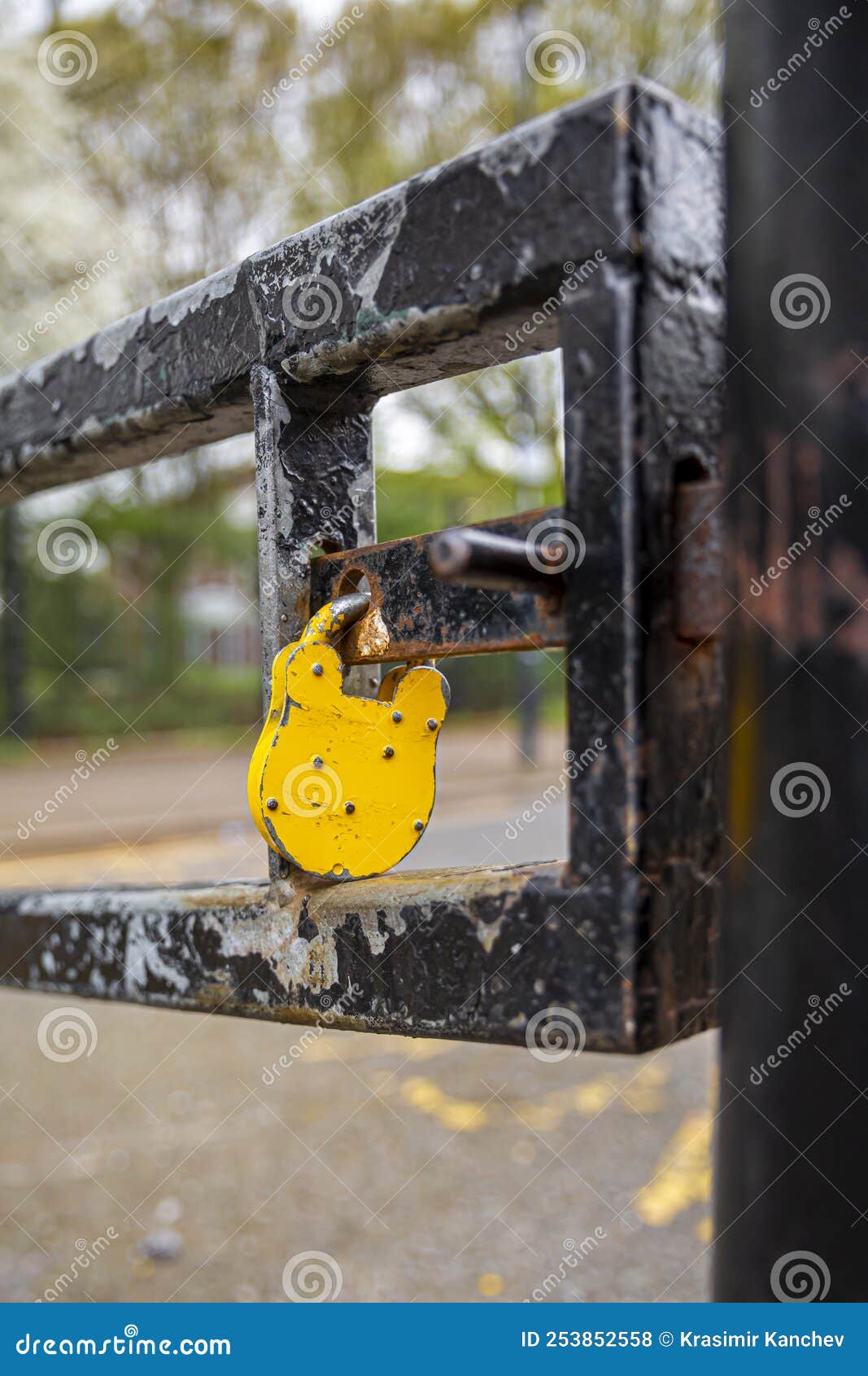 Yellow Padlock on the Barrier Post in a Restricted Area in London ...