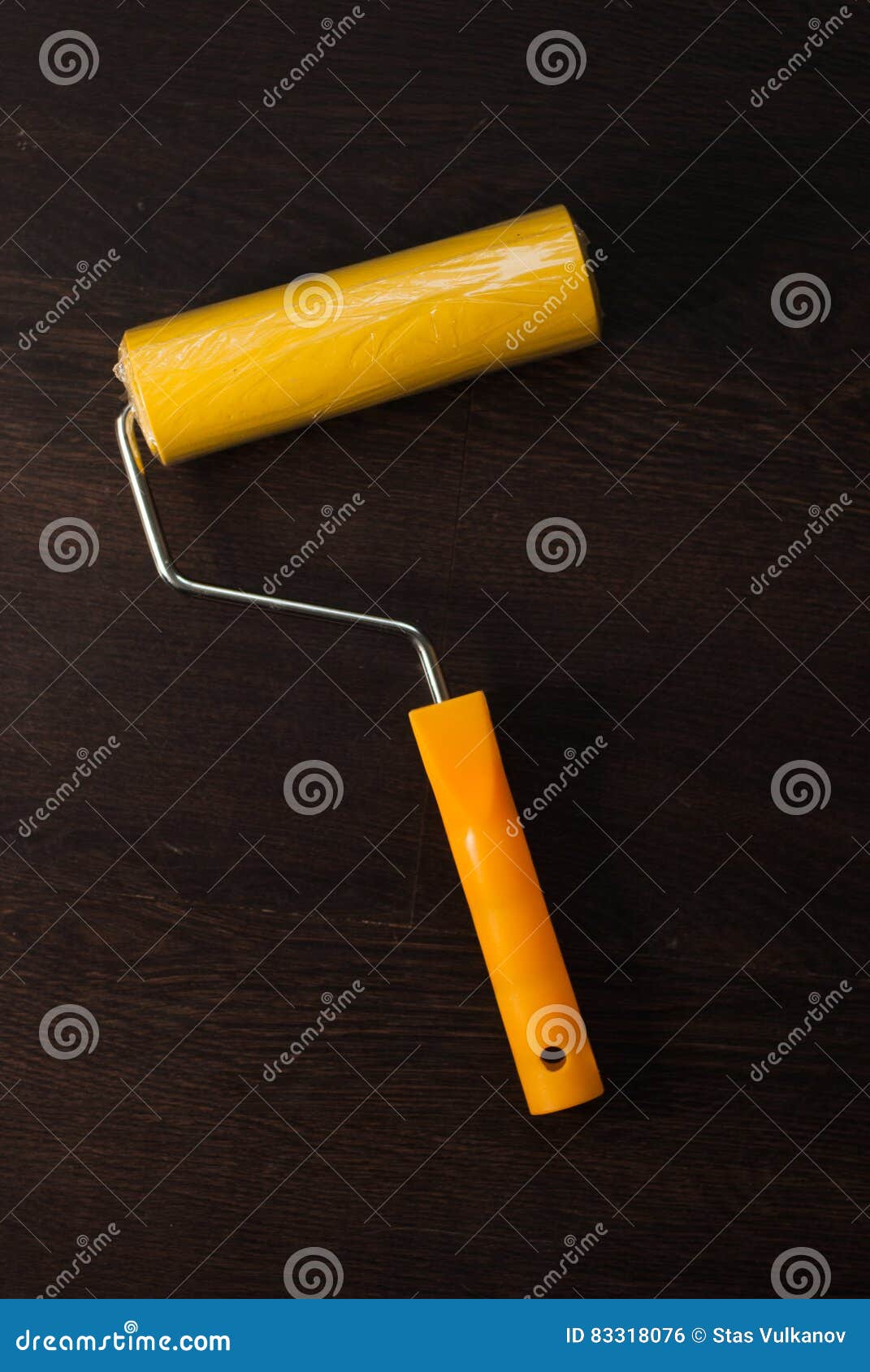 Yellow Paint Roller on a Dark Background Stock Photo - Image of house ...