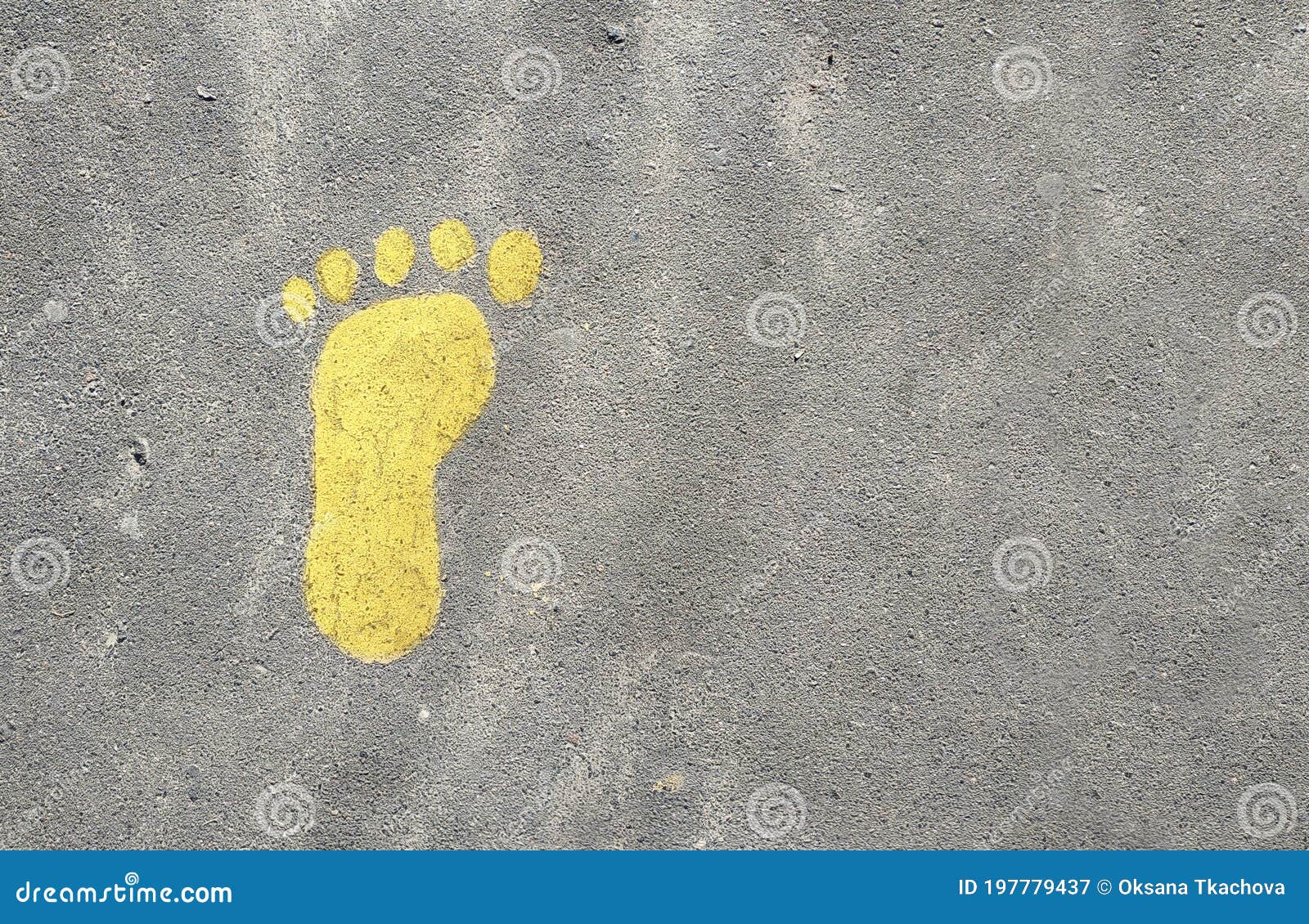 Yellow Painted Footprint on a Gray Asphalt Background. Top View Stock ...