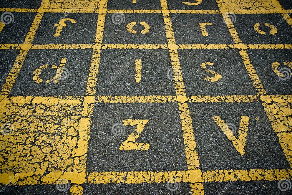 Yellow Painted Letters on Asphalt Stock Photo - Image of game, paint ...