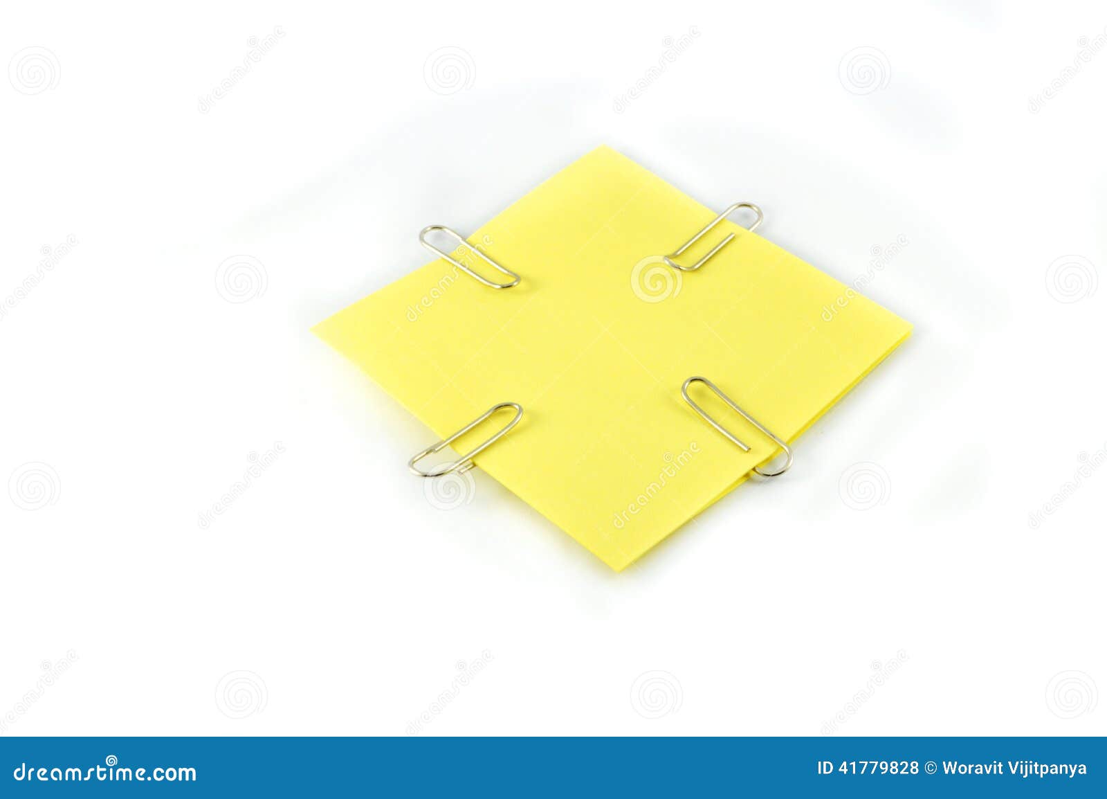 Yellow paper with clips stock photo. Image of empty, note - 41779828