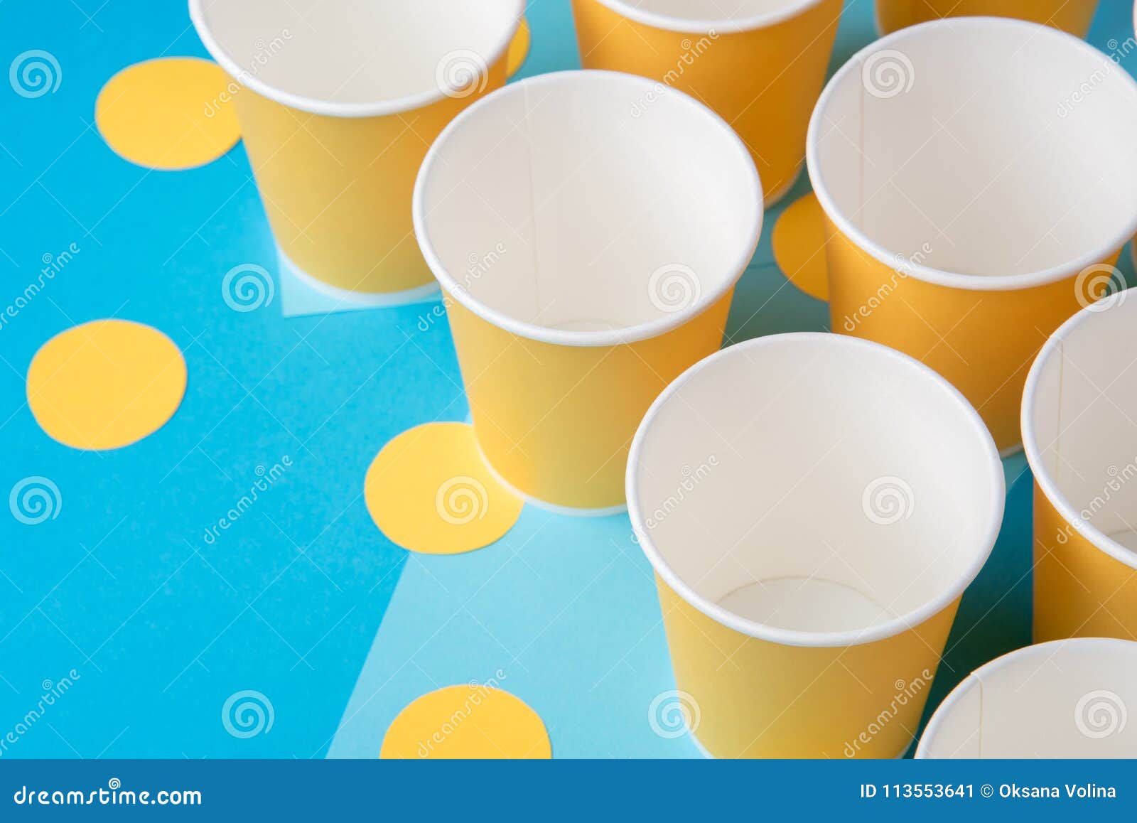 Yellow Paper Cups for a Party on a Blue Background Stock Image - Image ...