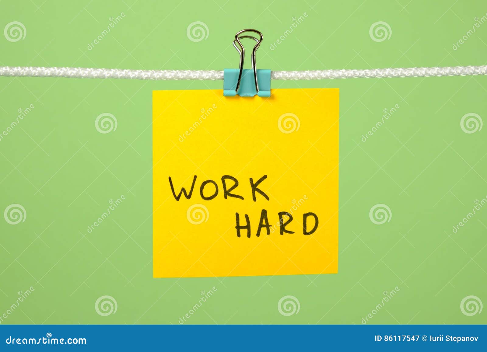 Yellow Paper Note on the String with Text â€œWork Hardâ€ Stock Image ...