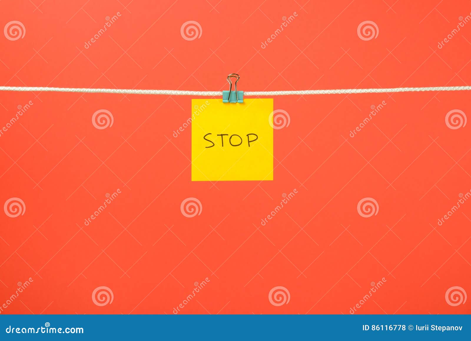 Yellow Paper Sheet on the String with Text â€œStopâ€ Stock Photo ...