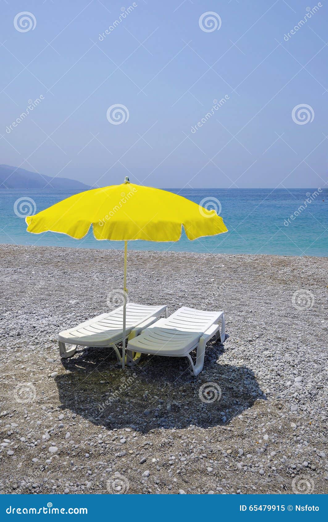 Yellow Parasol and Two White Sun Loungers Stock Image - Image of coast ...