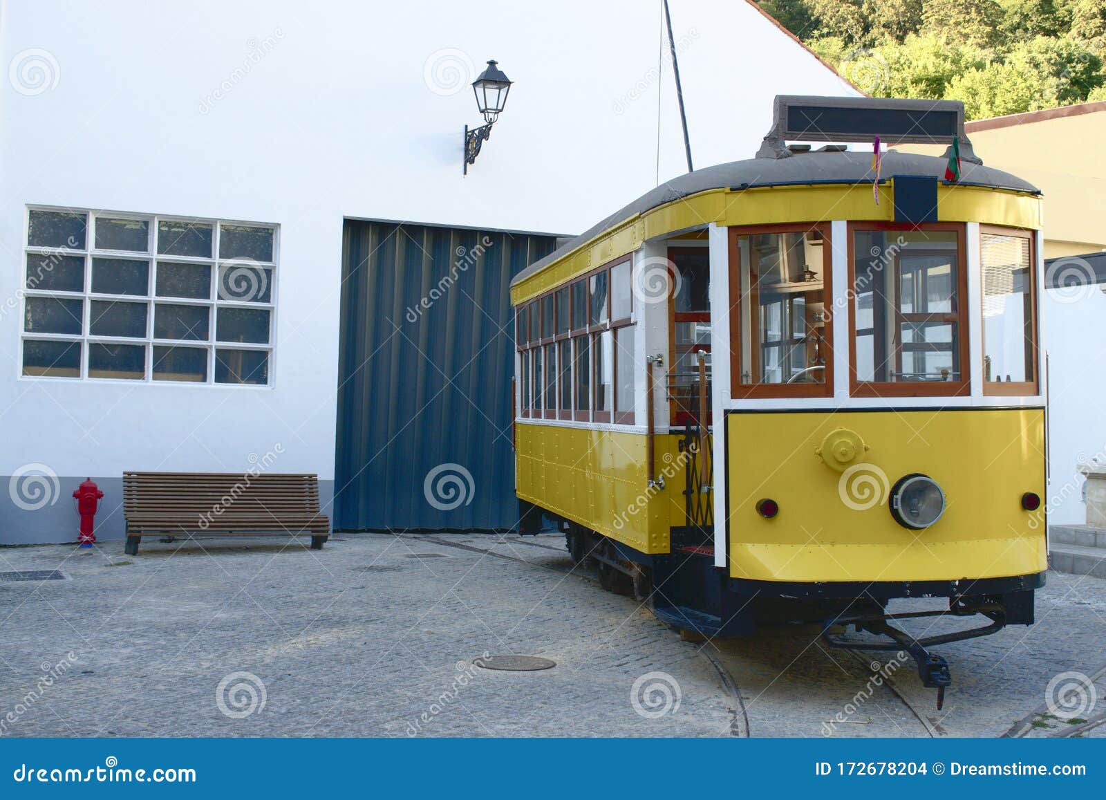 Yellow Street Car Parked in Front of Garage Stock Photo - Image of ...