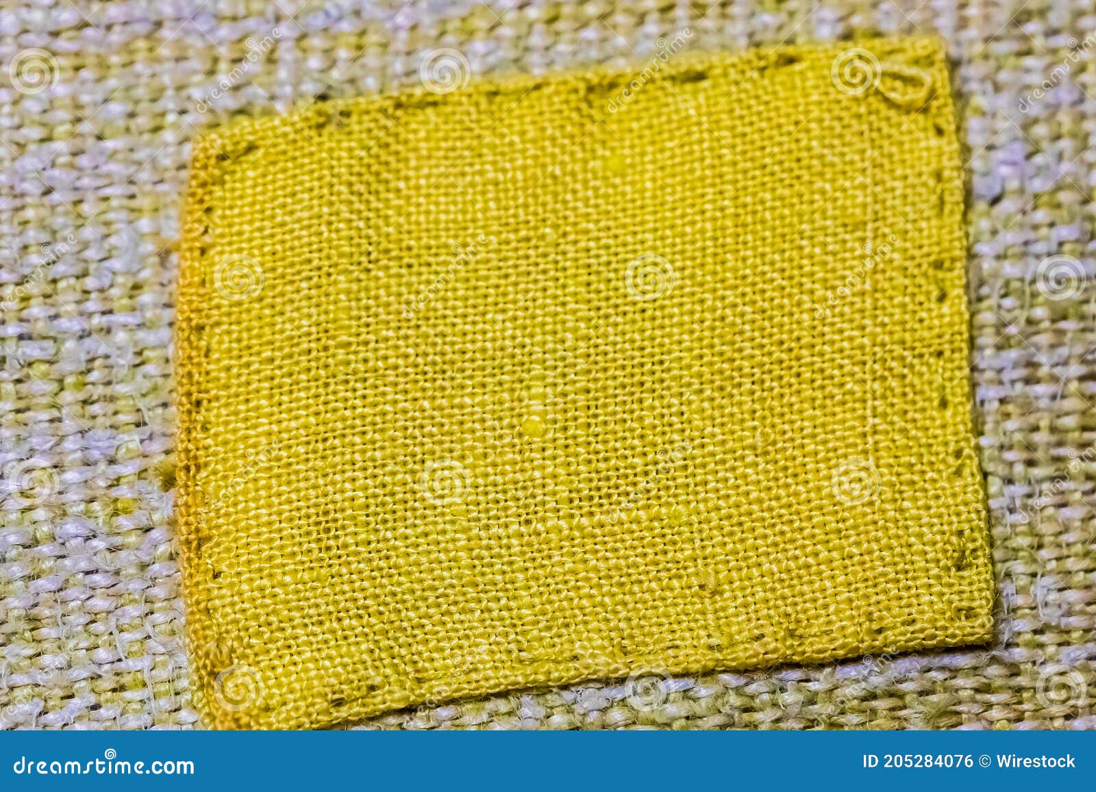 Yellow patch on a cloth stock photo. Image of texture - 205284076