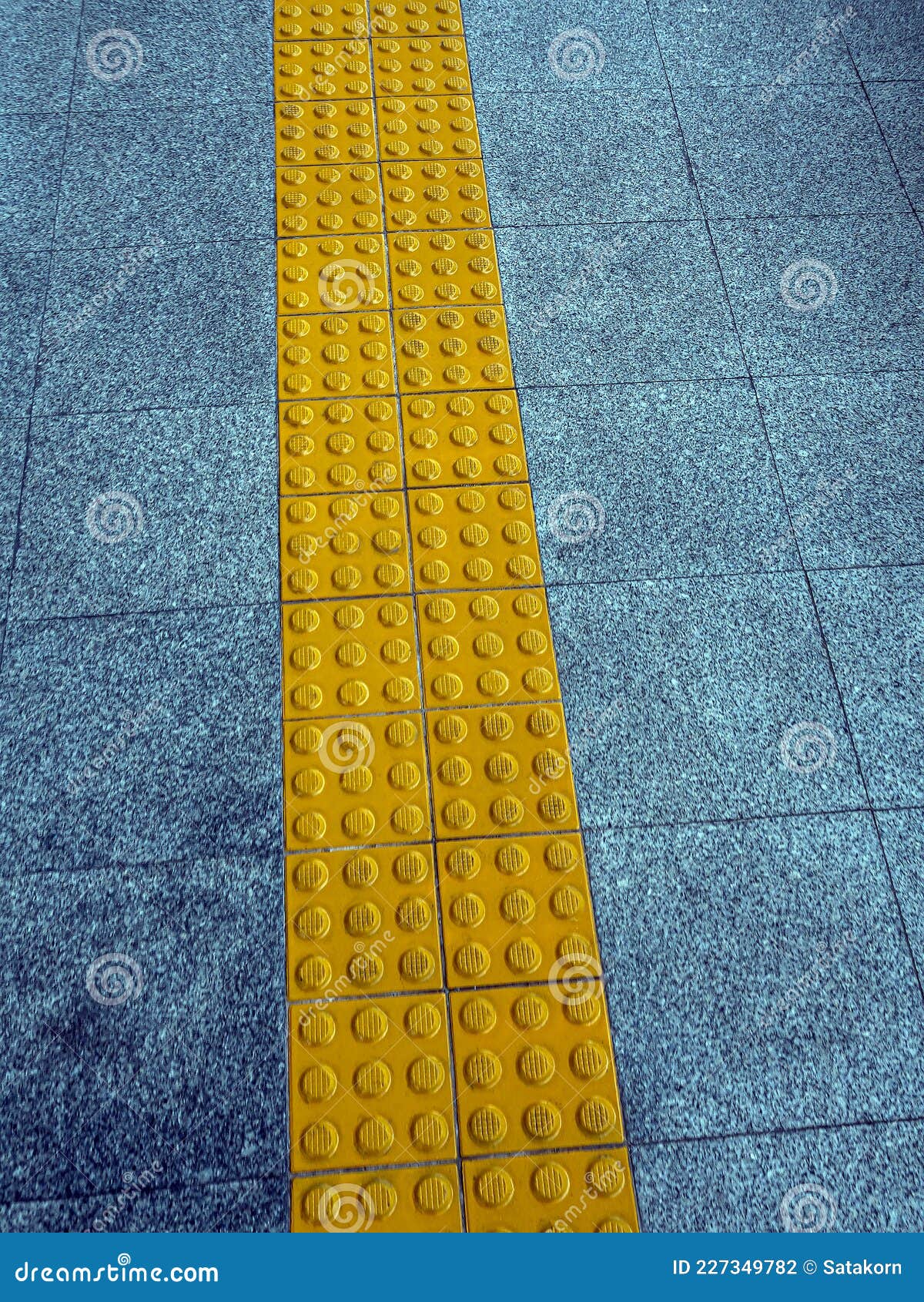 Yellow Pavement Has a Textured Surface To Serve As a Walking Guide for ...