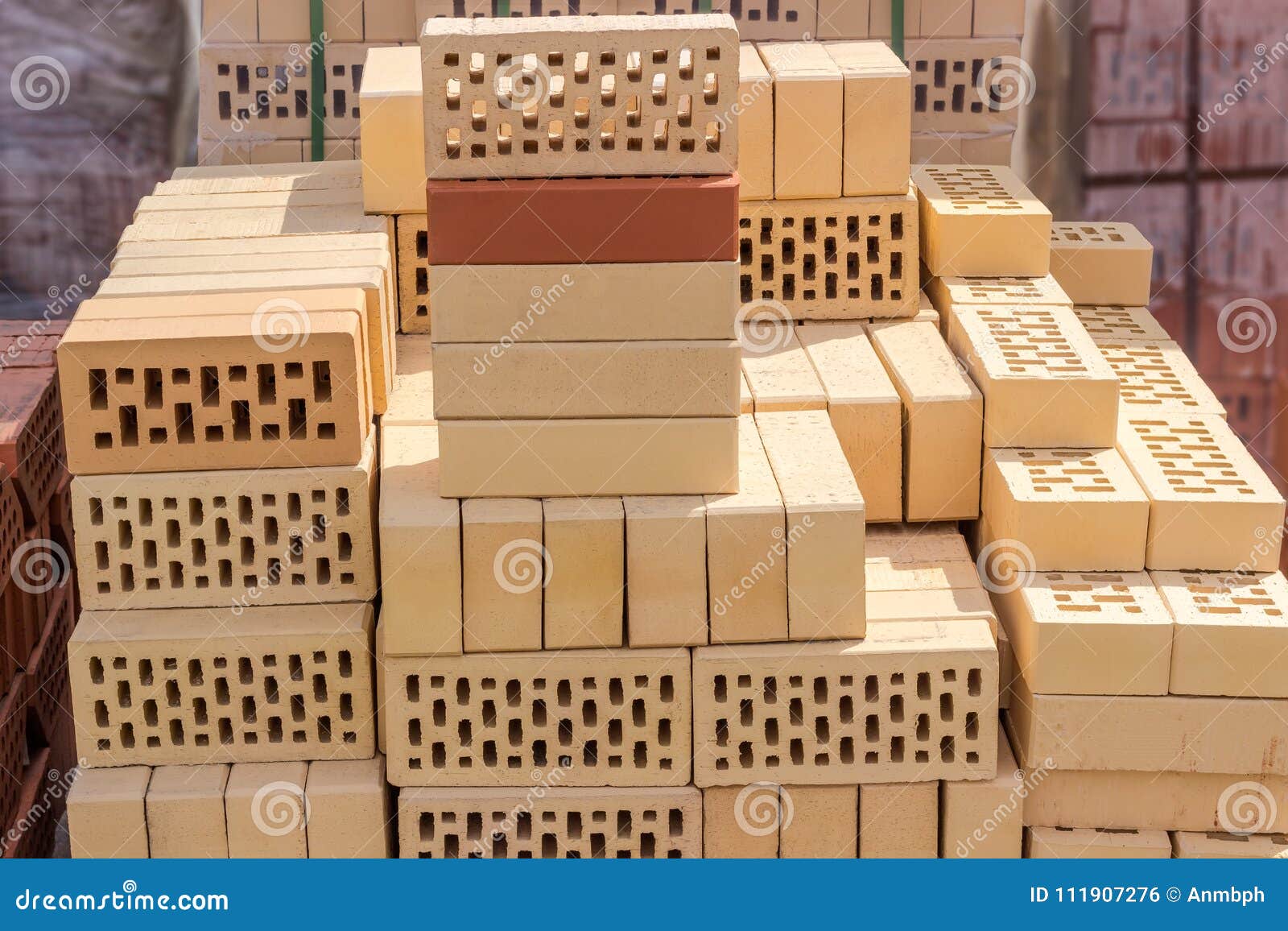 Yellow Perforated Bricks on Pallet on an Outdoor Warehouse Stock Photo ...