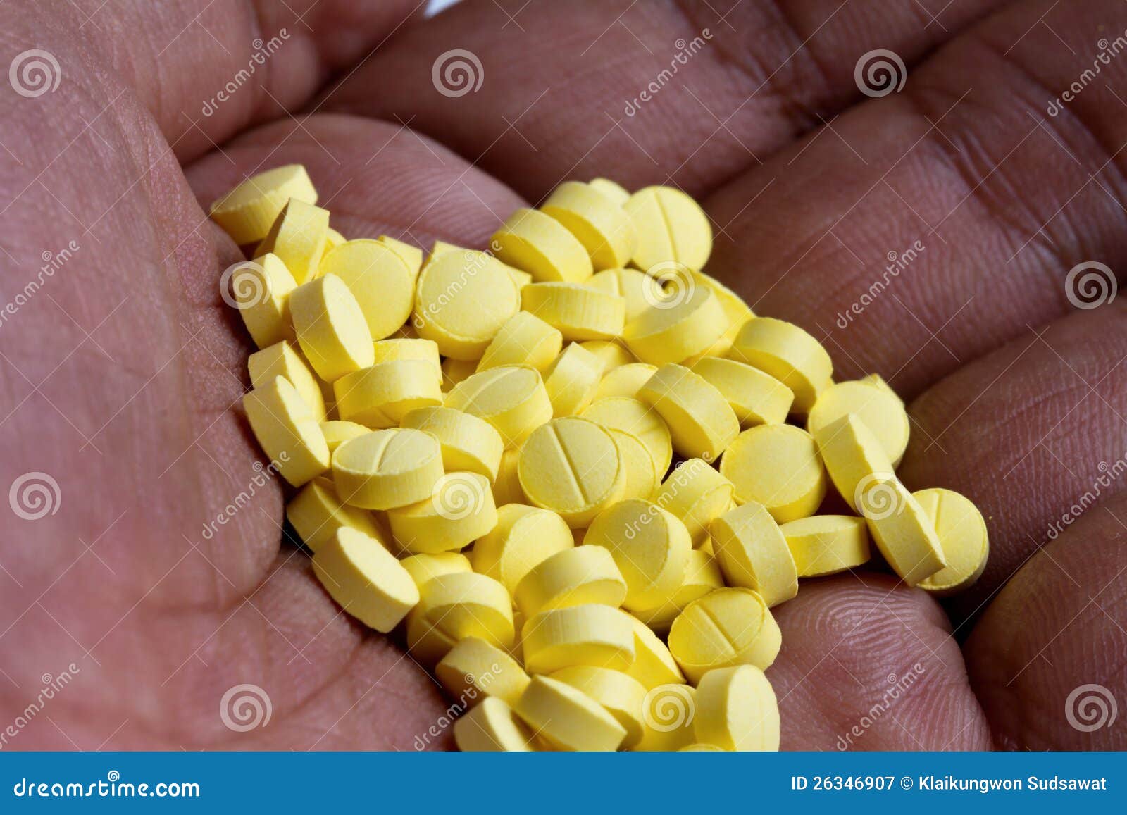 Yellow pill in hand stock image. Image of yellow, drug - 26346907