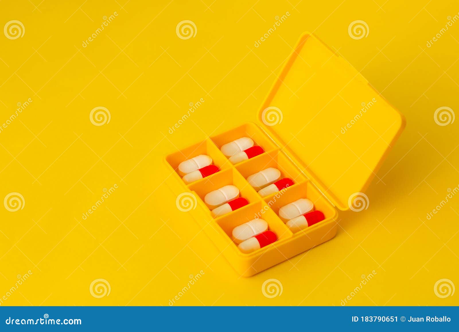 Yellow Pillbox with Pills on a Yellow Background Stock Image - Image of ...