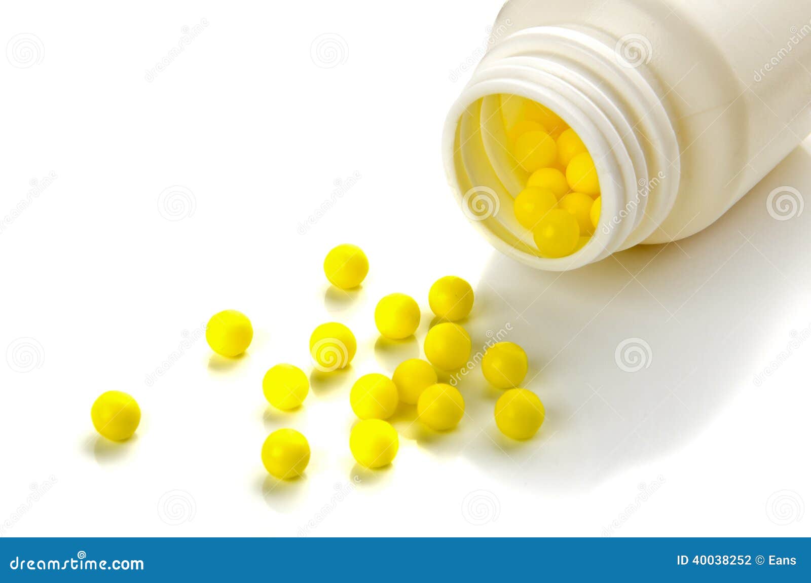 Yellow pills and bottle stock photo. Image of bottle - 40038252