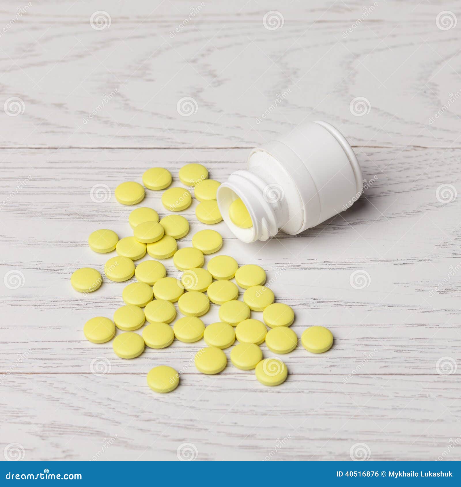 Yellow pills with bottle stock photo. Image of bottle - 40516876