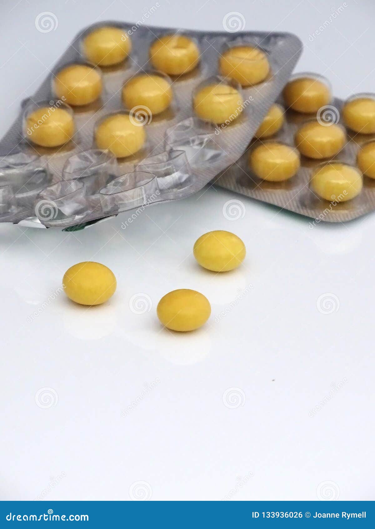 Yellow Pills Popped from Their Packets Stock Photo - Image of treatment ...