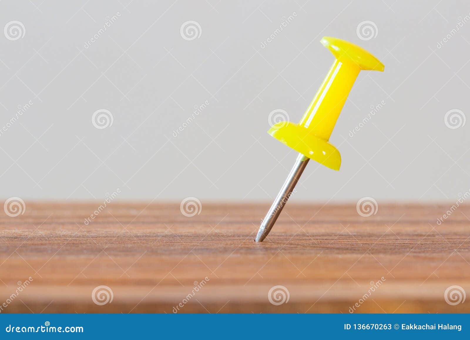 Yellow pin impaled stock image. Image of impaled, wood - 136670263