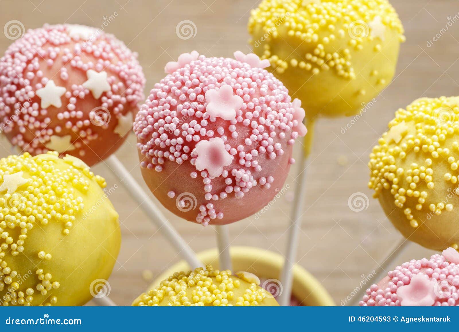 Yellow and pink cake pops stock image. Image of ball - 46204593