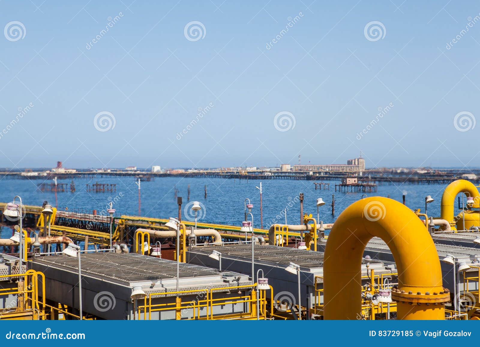 Yellow Pipes and Connections with Background of Sea Stock Image - Image ...