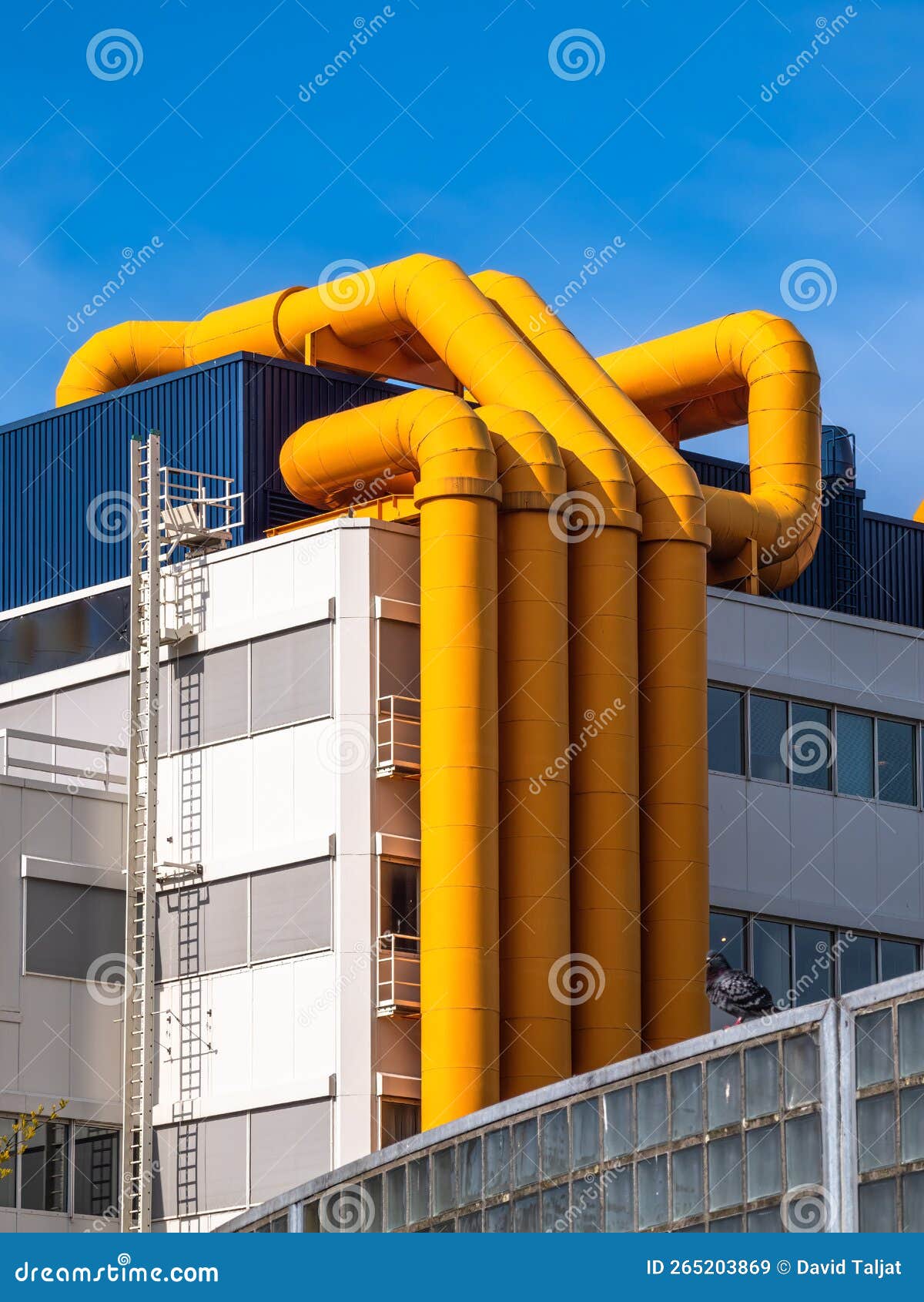 Yellow pipes in Rotterdam stock image. Image of construction - 265203869