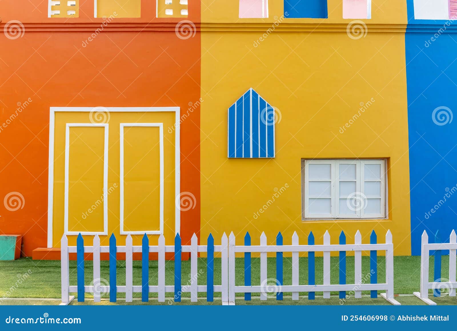 Yellow Plain Colour Wall with Blue Colour Window Stock Photo - Image of ...